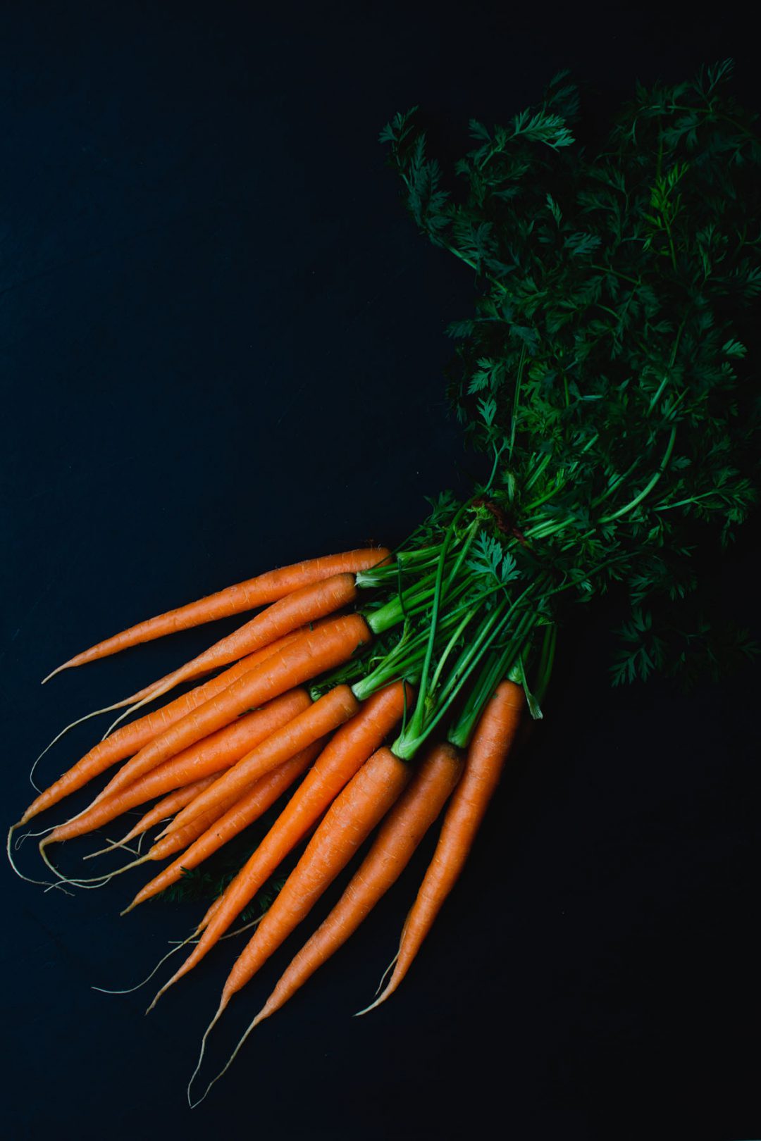 Geroosterde worteltjes uit de oven met knoflook en Parmezaan
